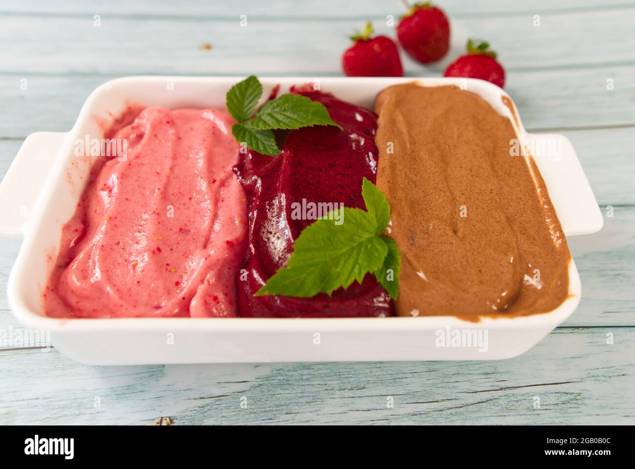 Homemade ice cream mixed flavors in one plate. Sweet dessert of ...
