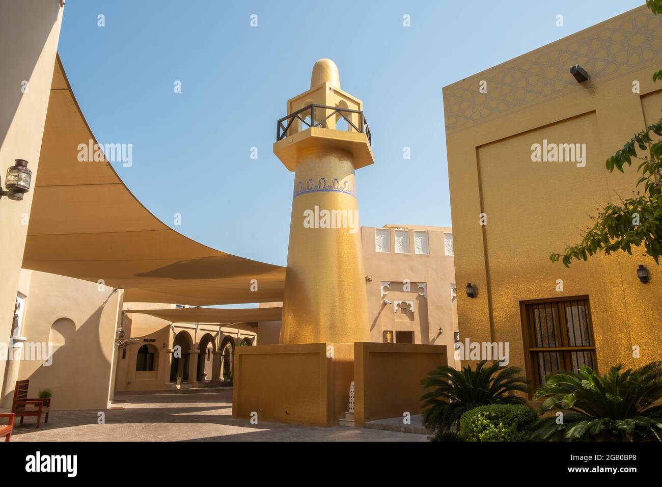 View of mosque tower at Katara cultural village, a waterfront area with ...