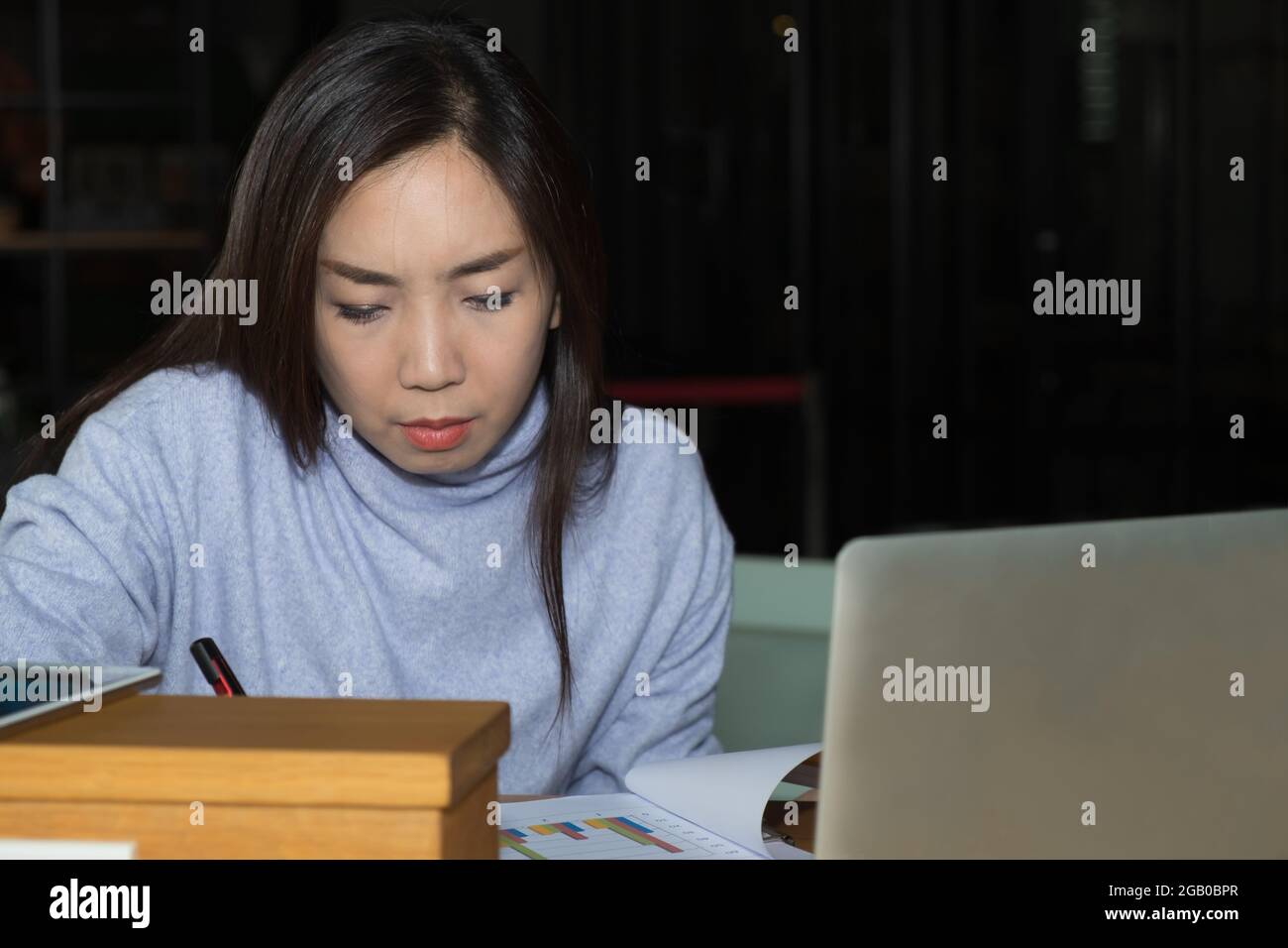 Smart beautiful clever Asian female thinking of serious information of ...