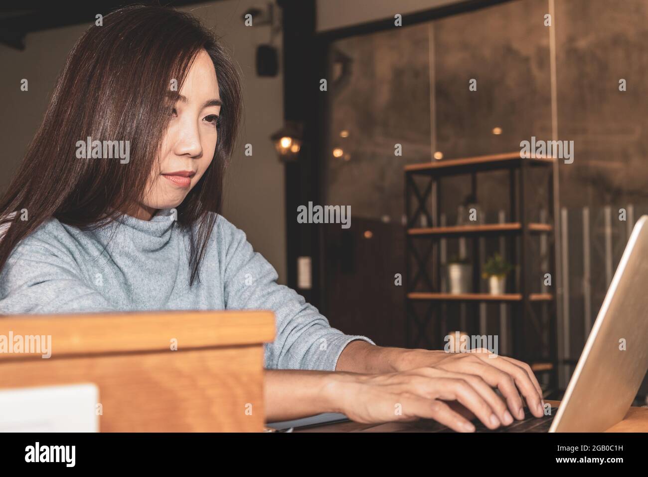 Smart beautiful clever Asian female thinking of serious information of ...