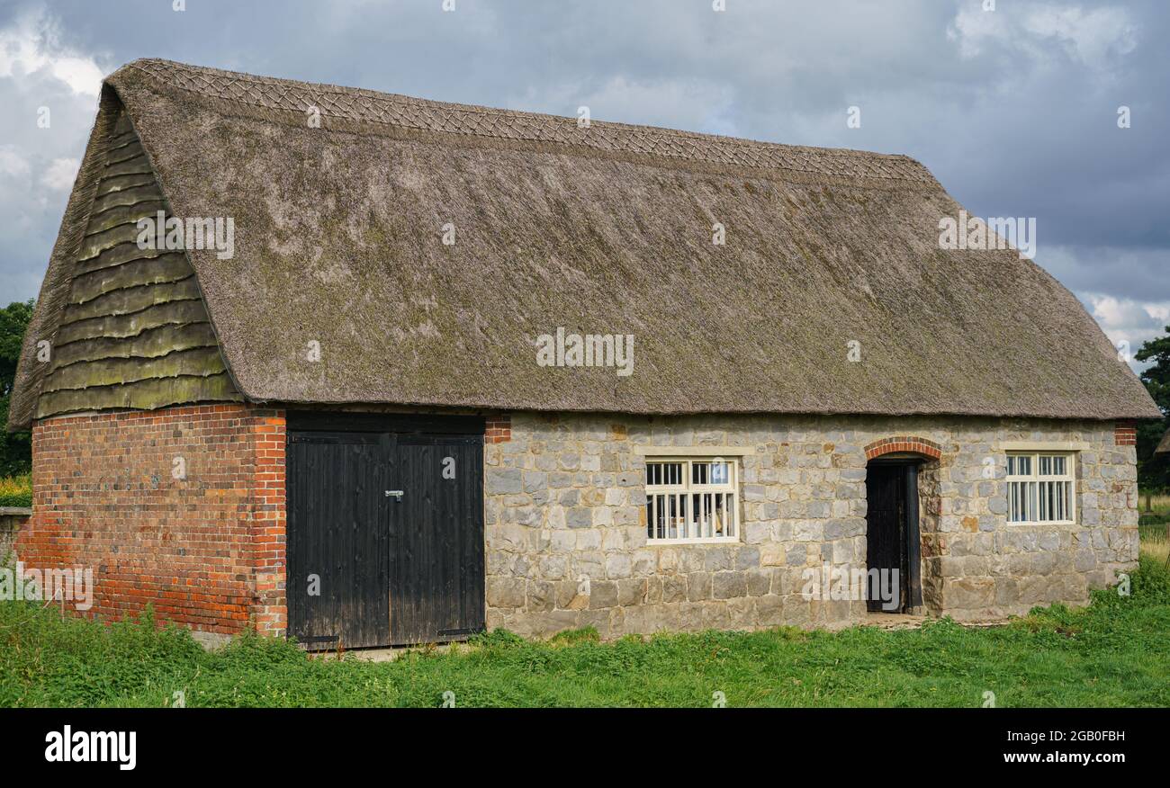 beautiful old stone and brick walled thatched barn converted to a farm ...