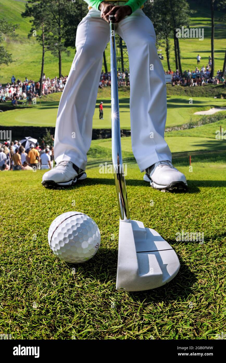 Man playing golf during tournament Stock Photo - Alamy