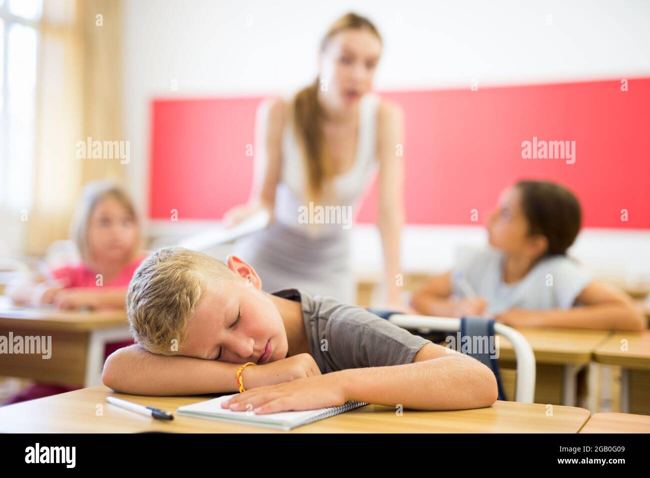 Boy have slept during lesson Stock Photo - Alamy