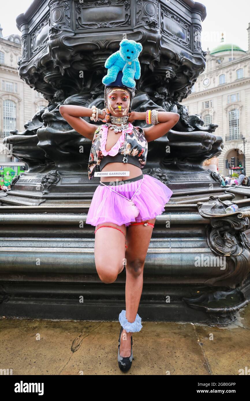 London, UK. 31 July 2021. The model attends a flash mob fashion show on ...