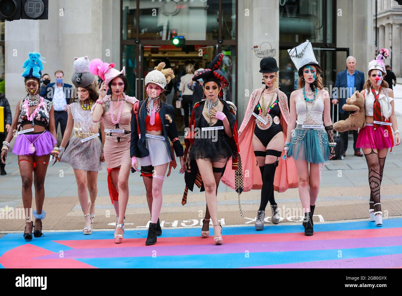 London, UK. 31 July 2021. The models attends a flash mob fashion show ...