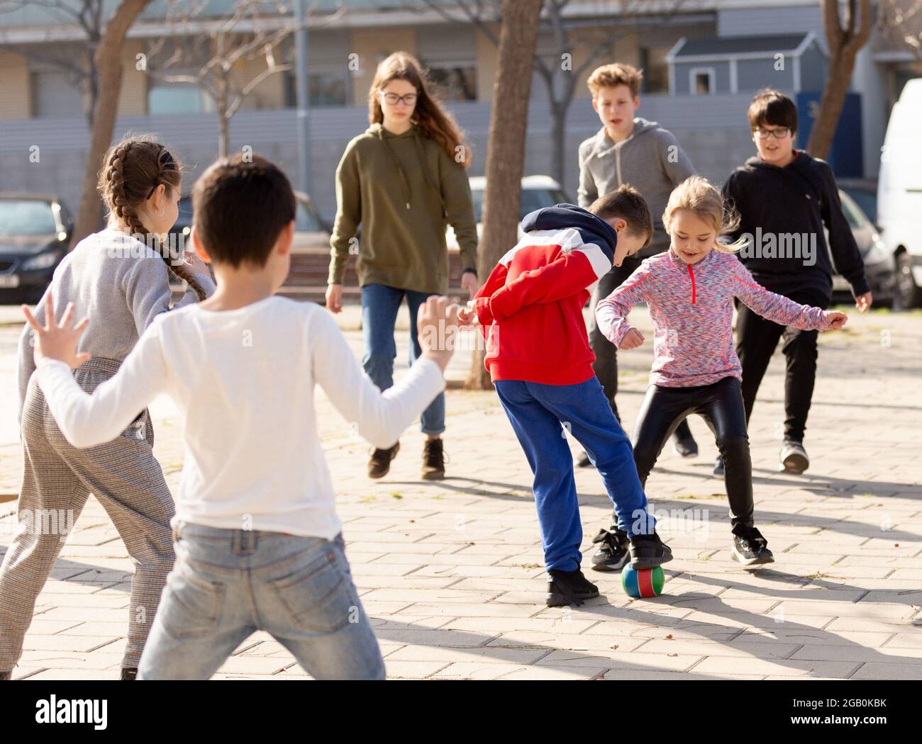Children playing soccer with ball Stock Photo - Alamy