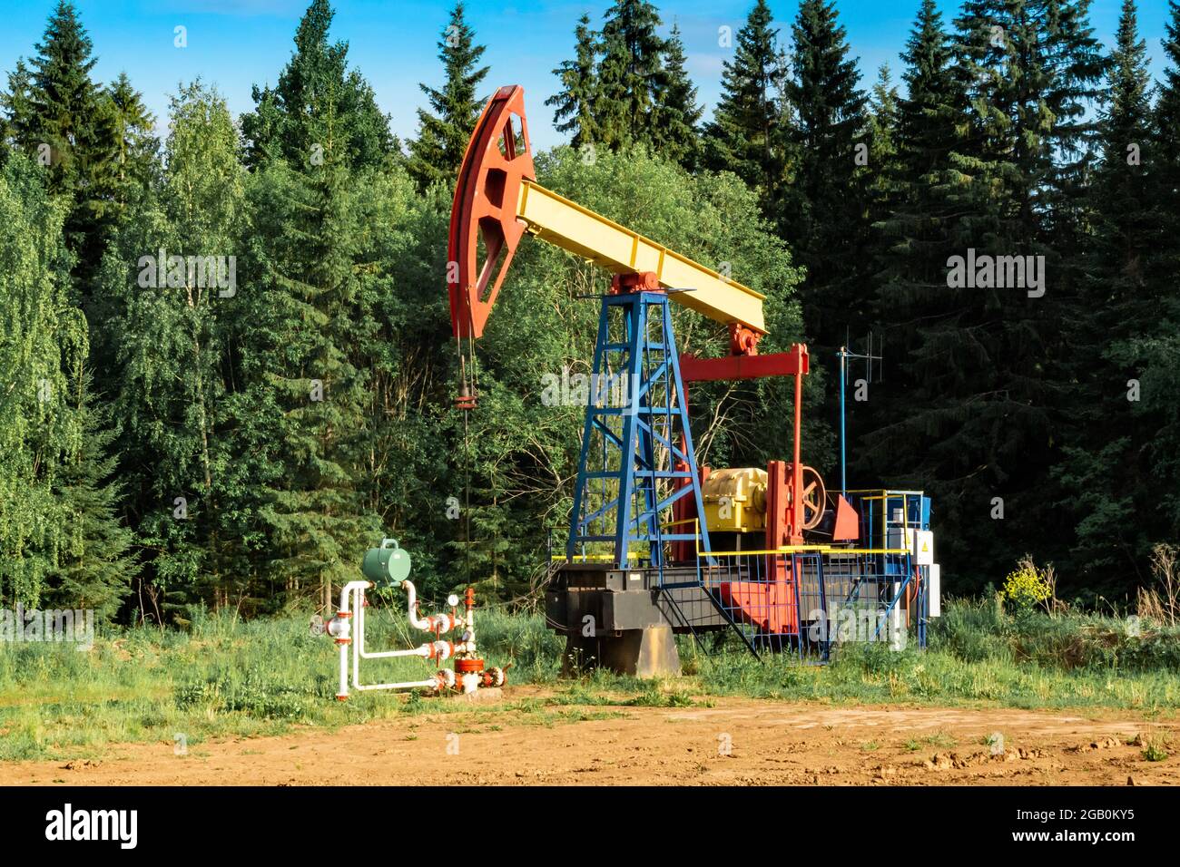 oil pumping stations pumpjacks in a clearing in the forest Stock Photo ...