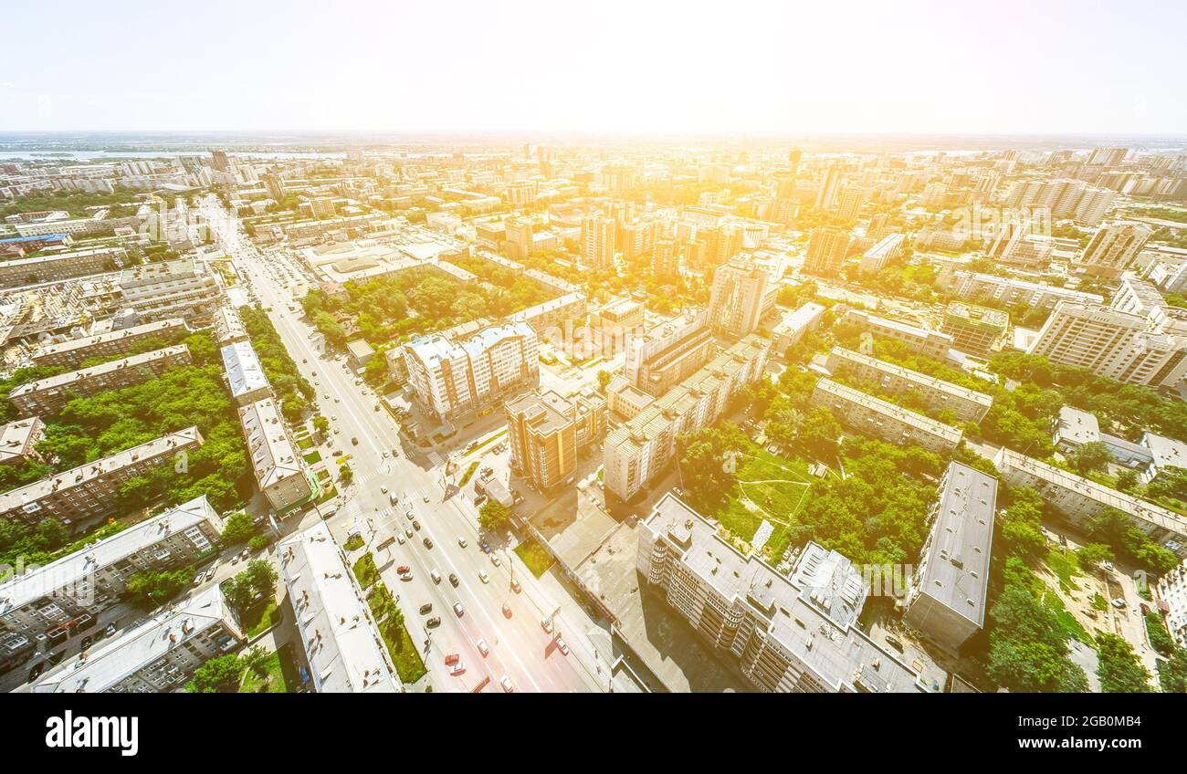 Aerial city view with crossroads and roads, houses, buildings, parks ...