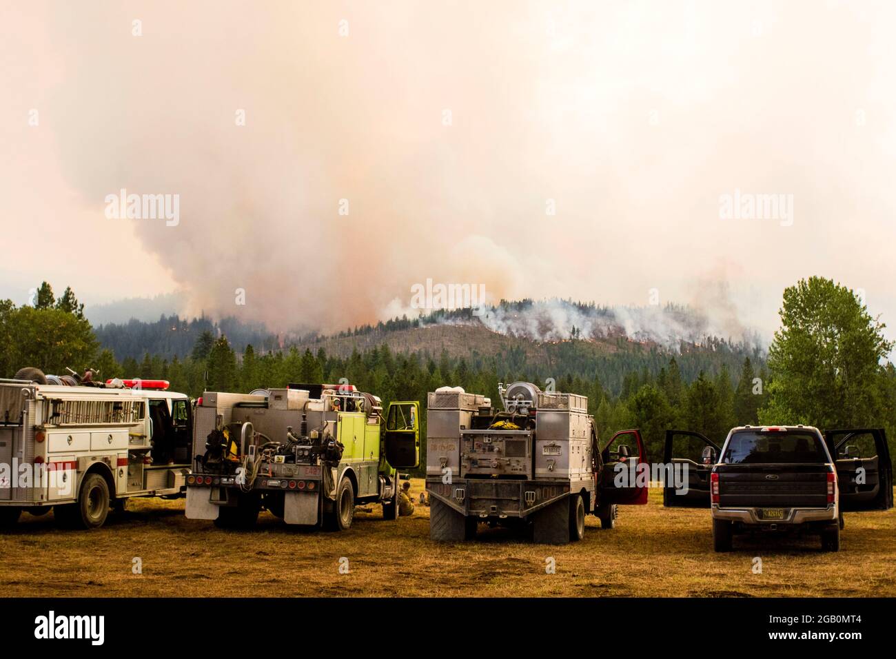 Fire crews watch the Dixie fire. The Dixie fire has grown to over ...
