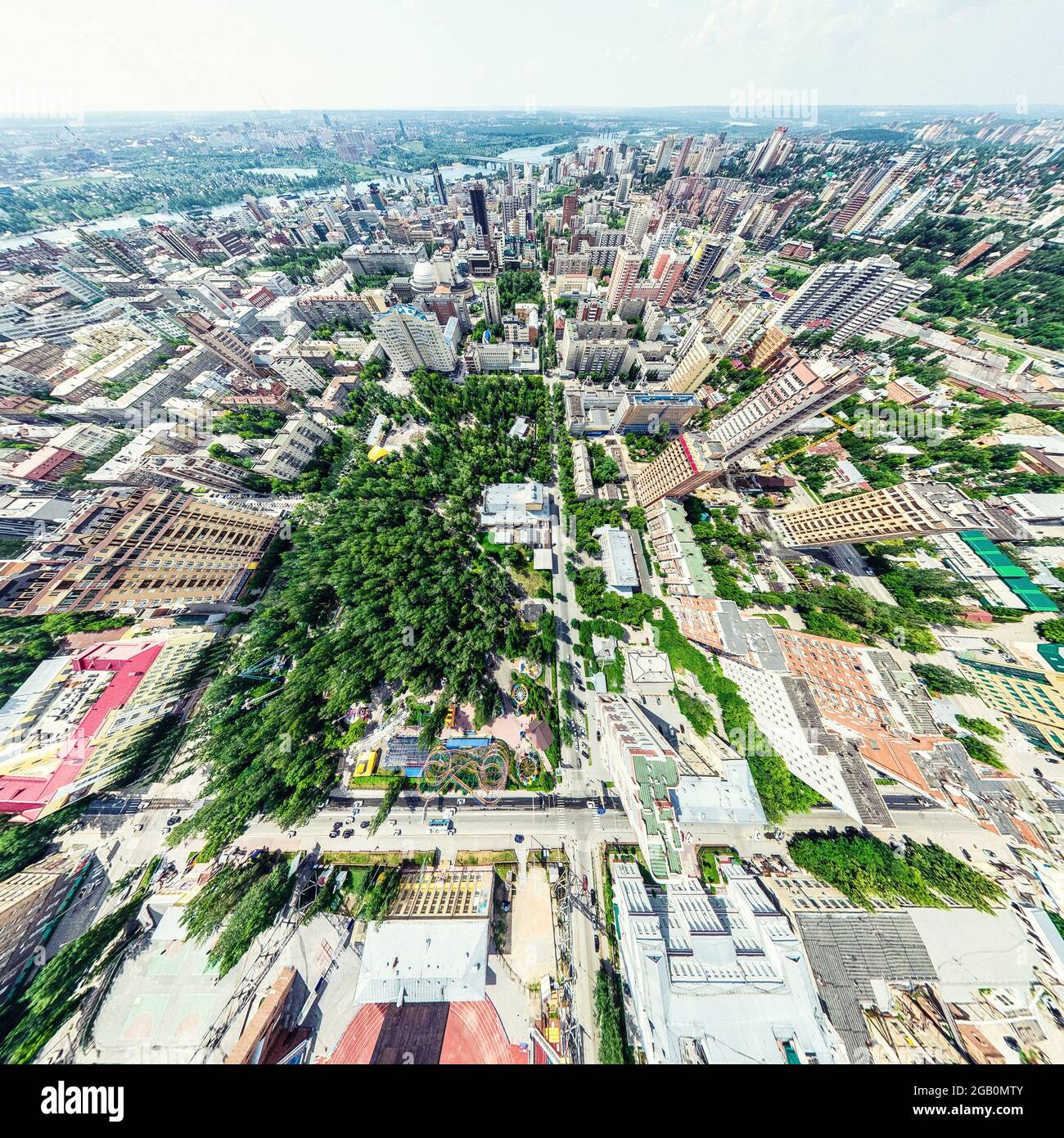 Aerial city view with crossroads and roads, houses, buildings, parks ...