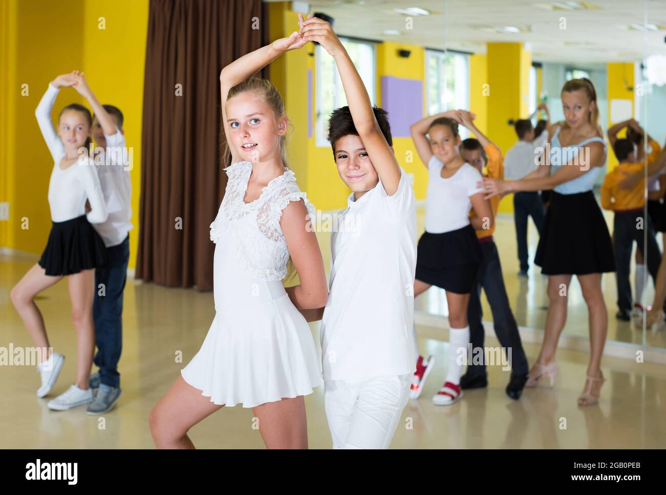 Children dancing pair dance in class Stock Photo - Alamy