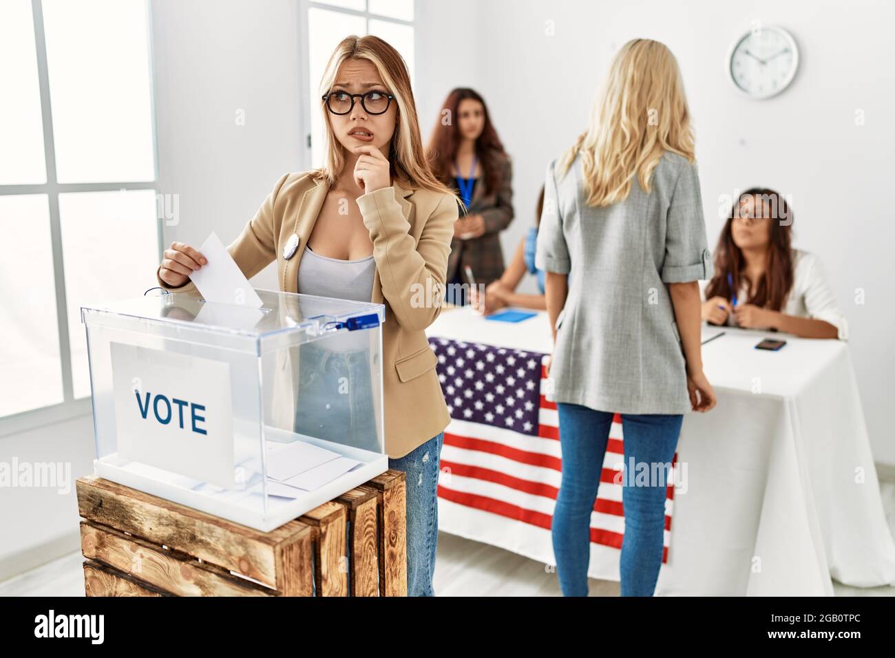 Group of young girls voting at democracy referendum thinking worried ...