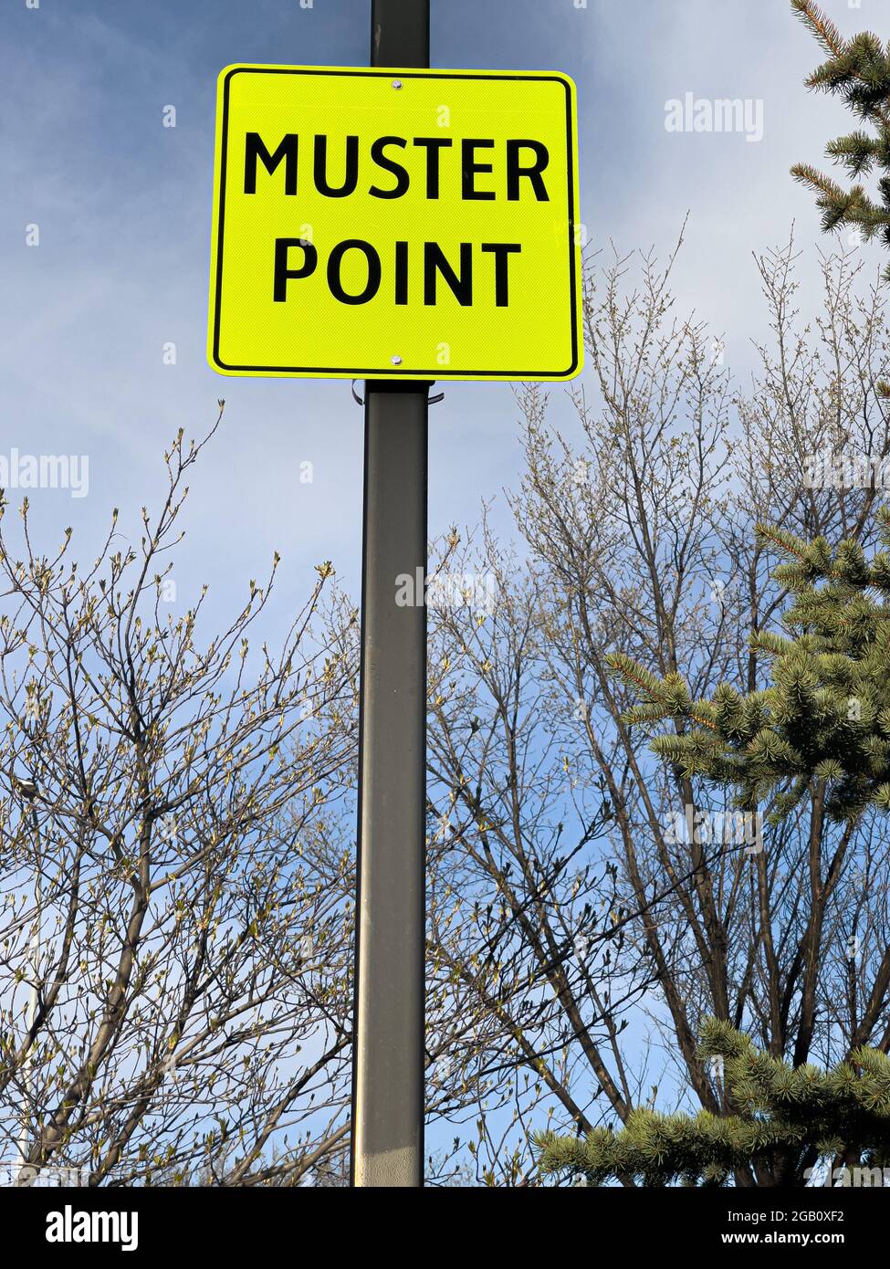 Muster point sign for people to meet during emergencies Stock Photo - Alamy