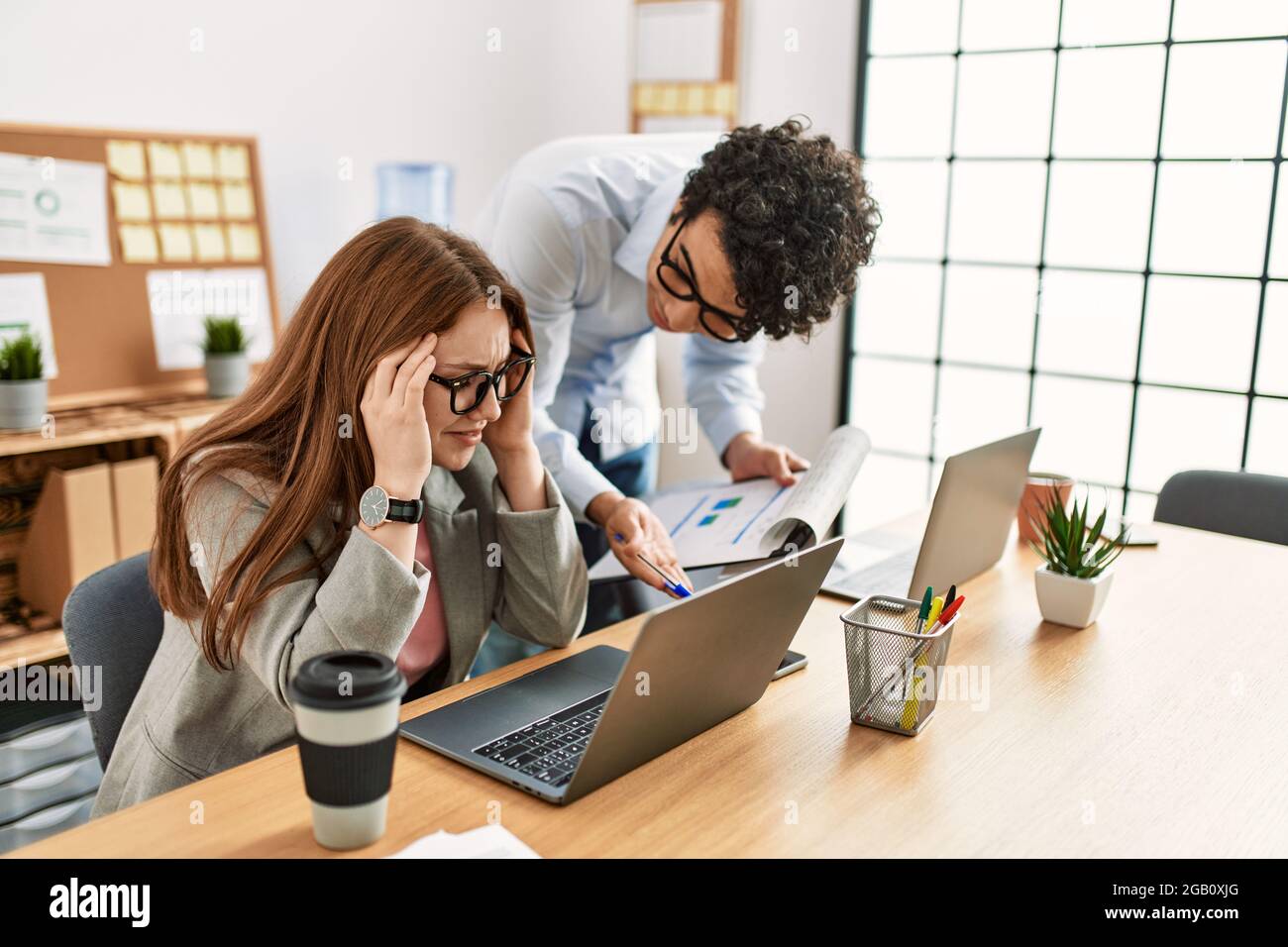 Business boss angry with stressed employee at the office Stock Photo ...
