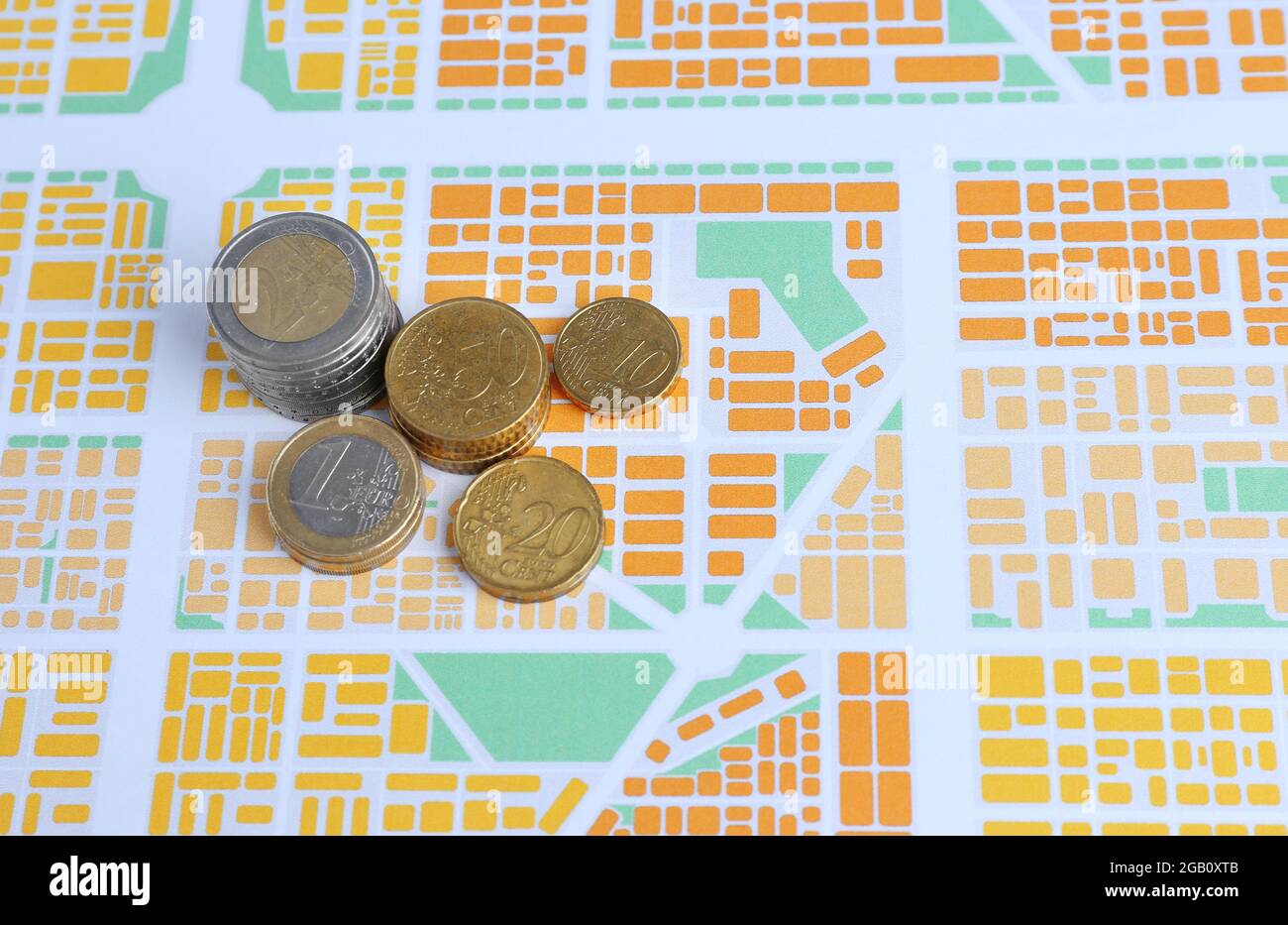 Euro coins on map background Stock Photo - Alamy