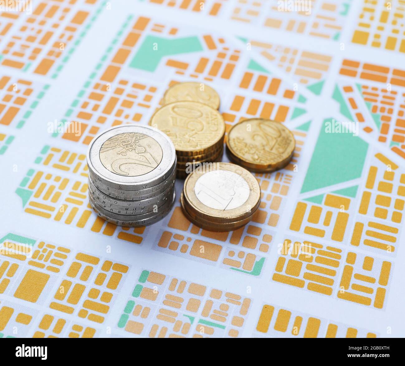 Euro coins on map background Stock Photo - Alamy