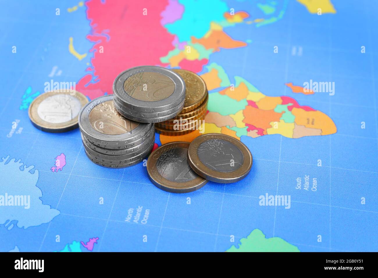 Euro coins on map background Stock Photo - Alamy