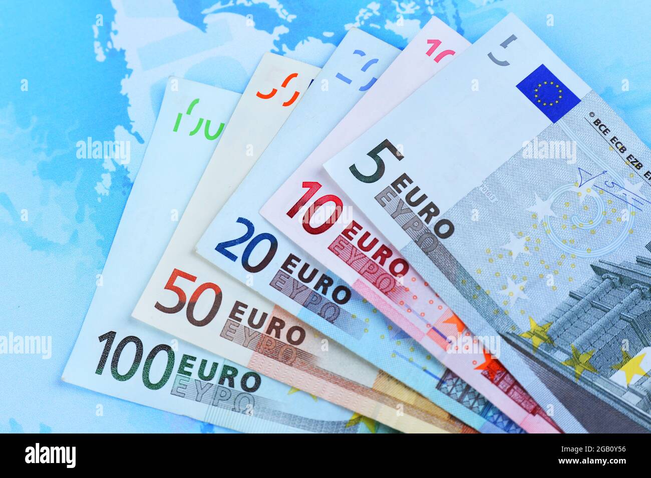 Different euro banknotes on a map background Stock Photo - Alamy
