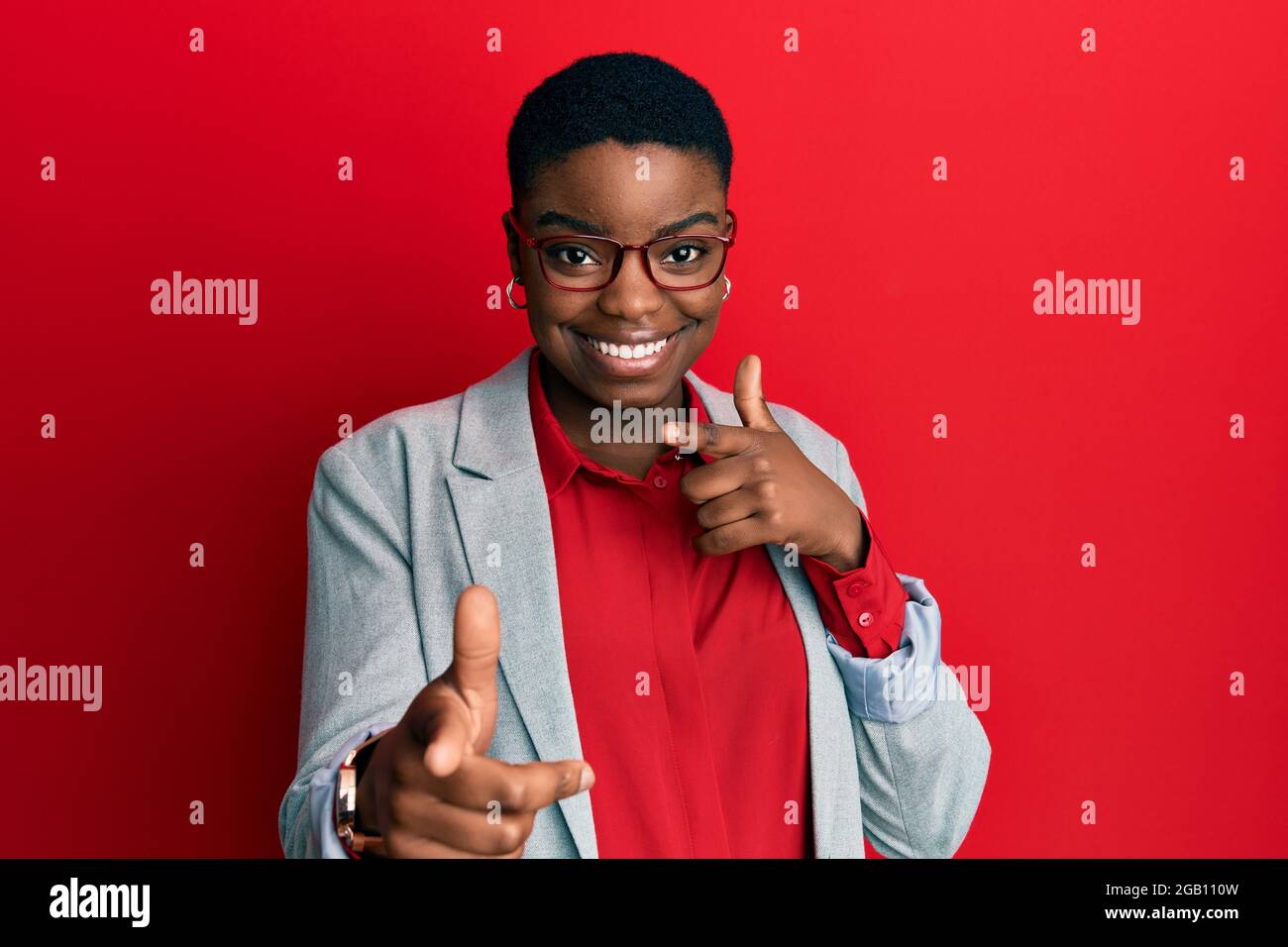 Young african american woman wearing business jacket and glasses ...