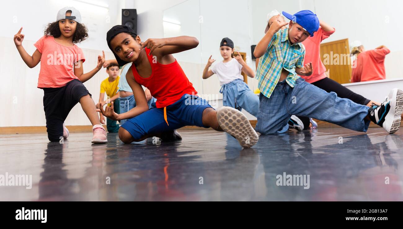 Group of children training hip hop movements in dance class Stock Photo ...