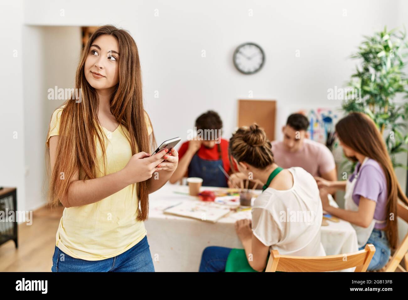 Group of people smiling happy drawing at art studio Stock Photo - Alamy