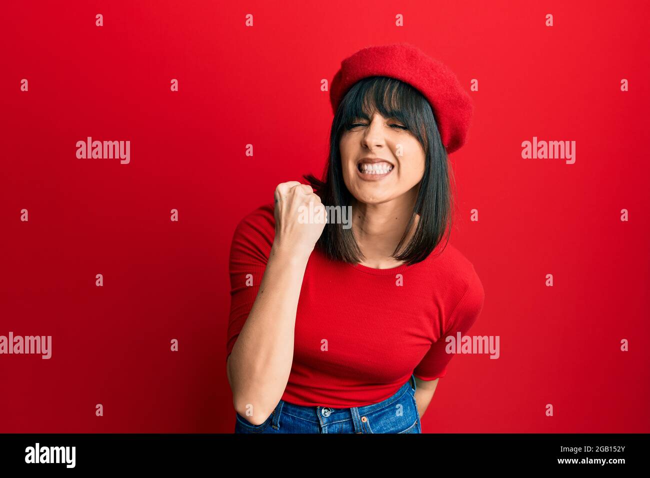 Young hispanic woman wearing french look with beret angry and mad ...