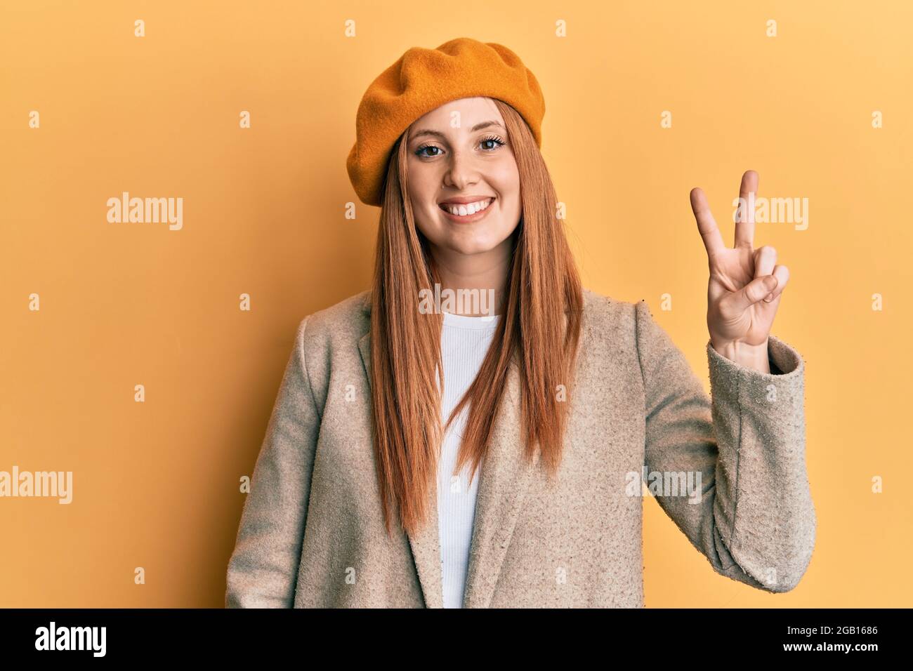 Young irish woman wearing french look with beret smiling with happy ...