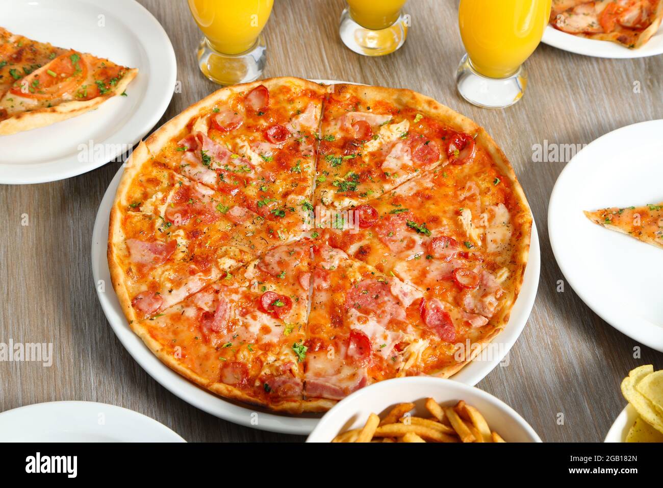 Table at home with pizza and drinks for friends Stock Photo - Alamy