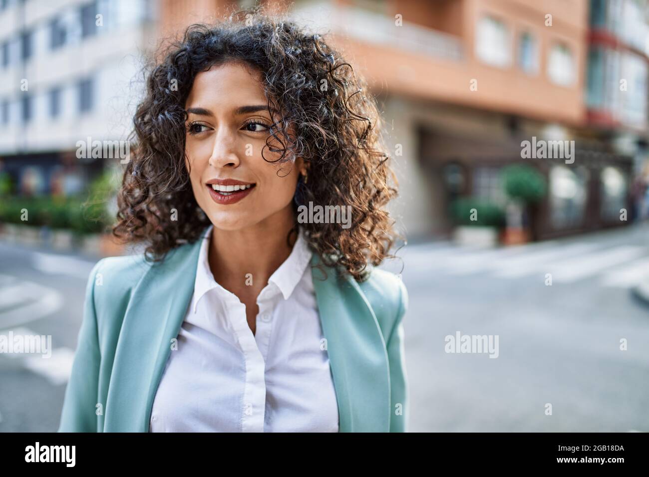 Young hispanic business woman wearing professional look smiling ...