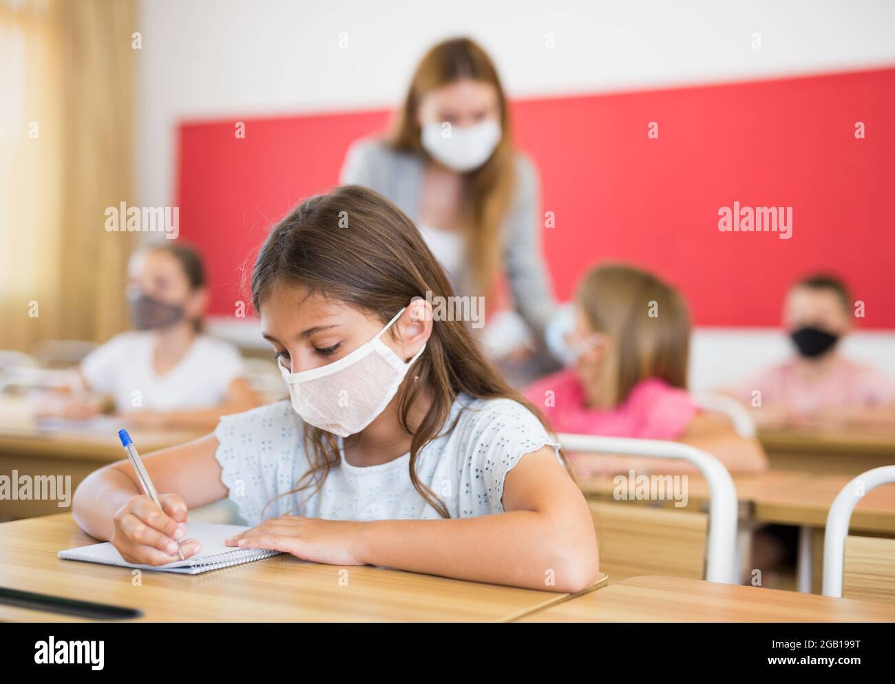 Kids sitting in classroom Stock Photo - Alamy