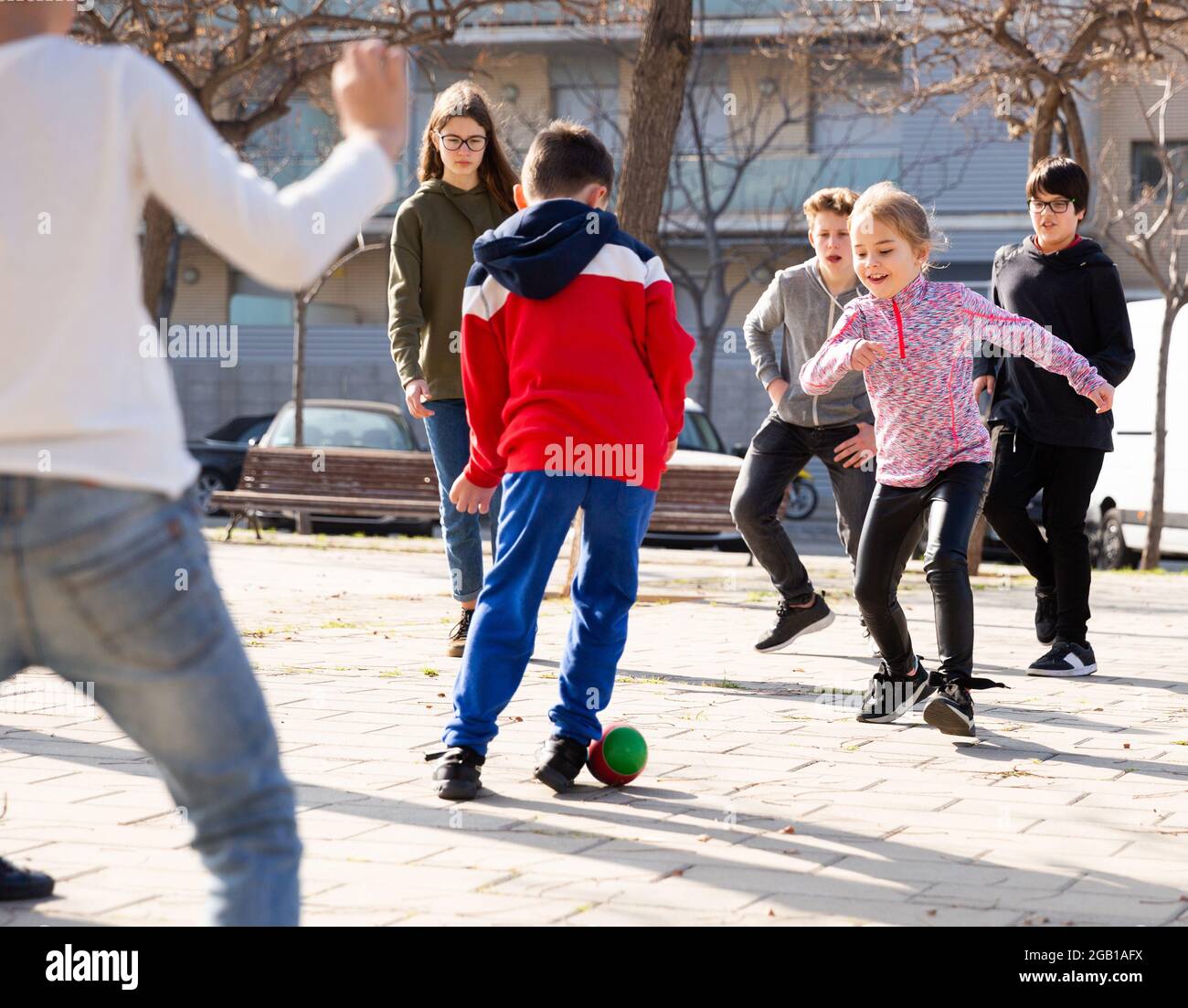 Children playing soccer with ball Stock Photo - Alamy