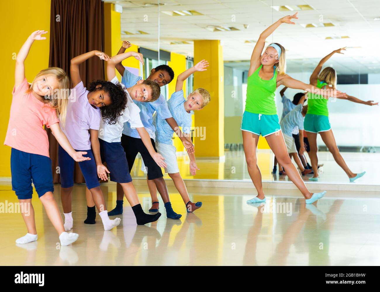 Children dancing choreography with female coach Stock Photo - Alamy