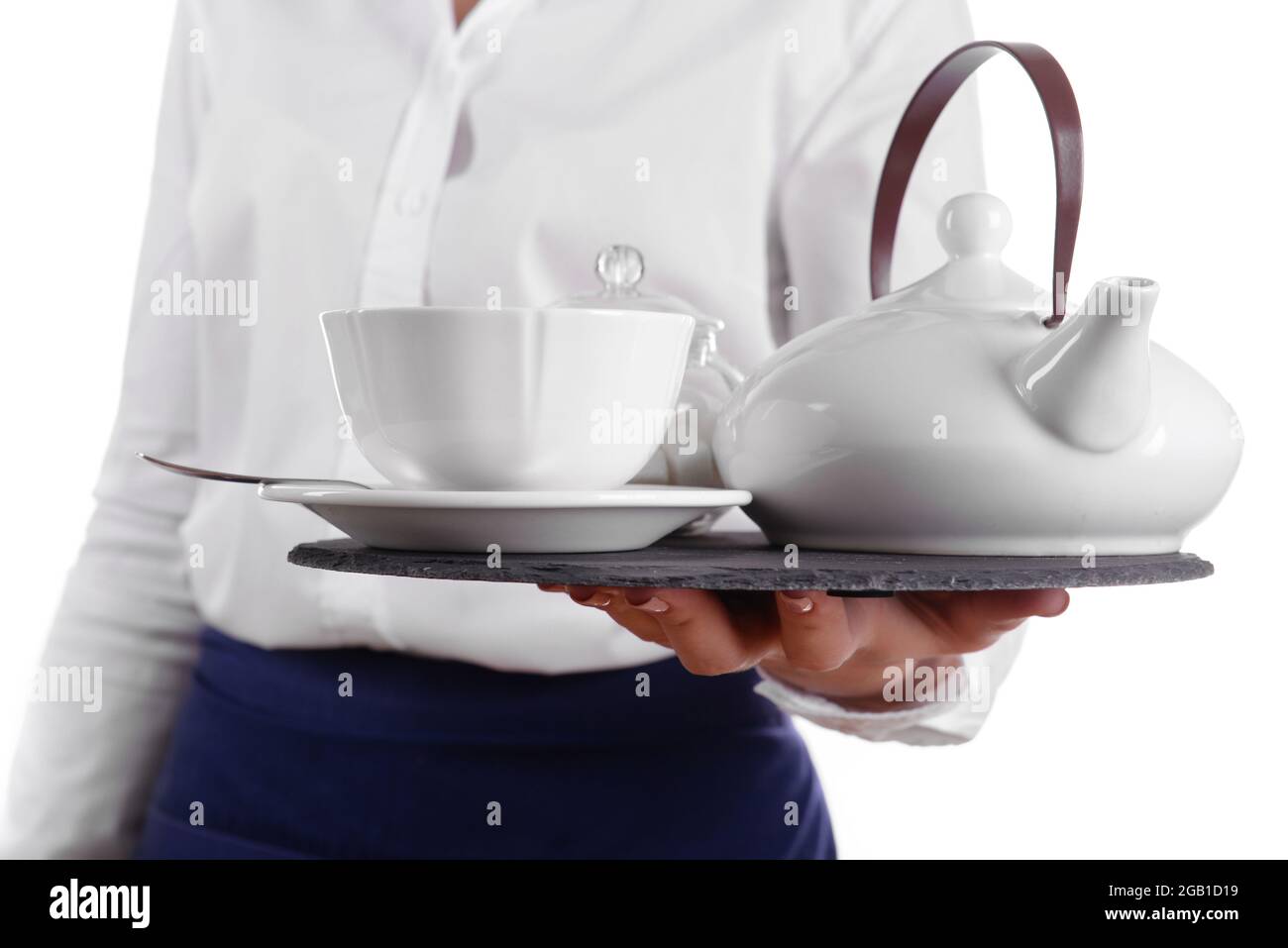Waiter holding tray with cup and teapot on white background Stock Photo ...