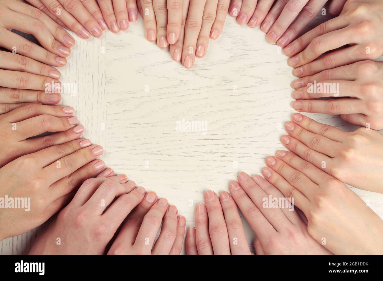 Group of people making heart symbol hi-res stock photography and images ...