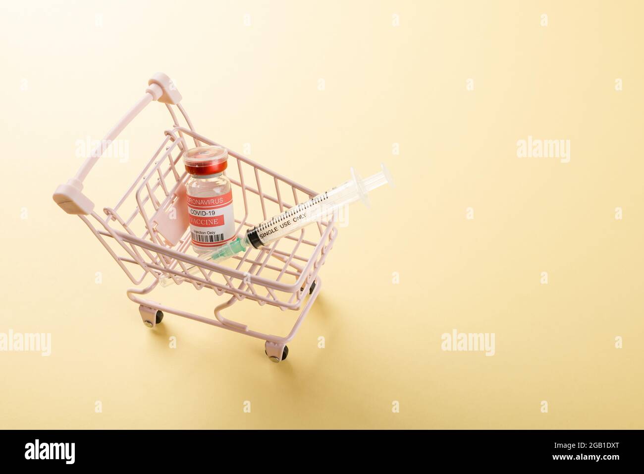 Shopping cart with vaccine vials bottles and syringes for vaccination ...