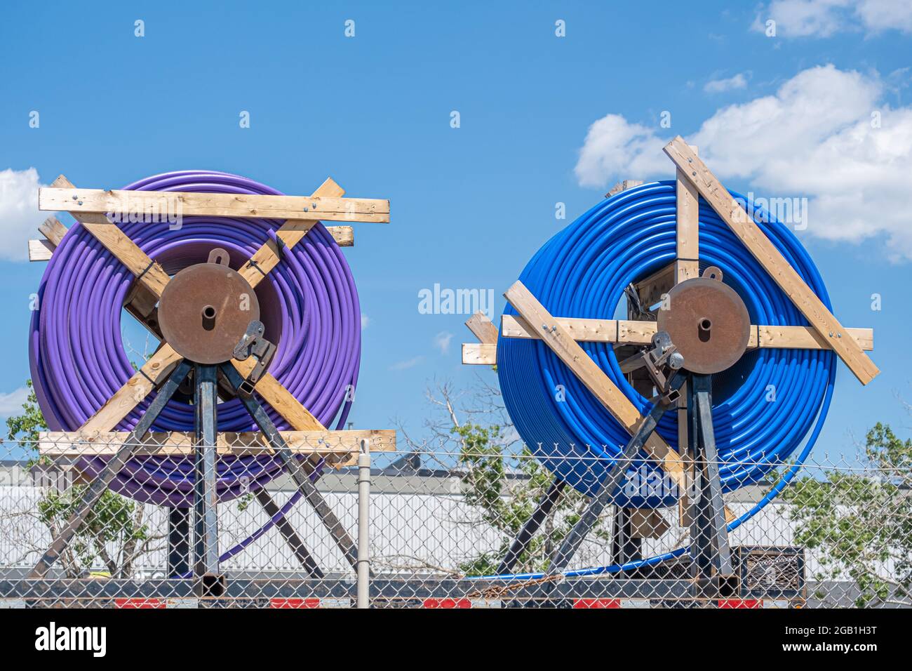 Color coded underground cables on a construction site Stock Photo - Alamy