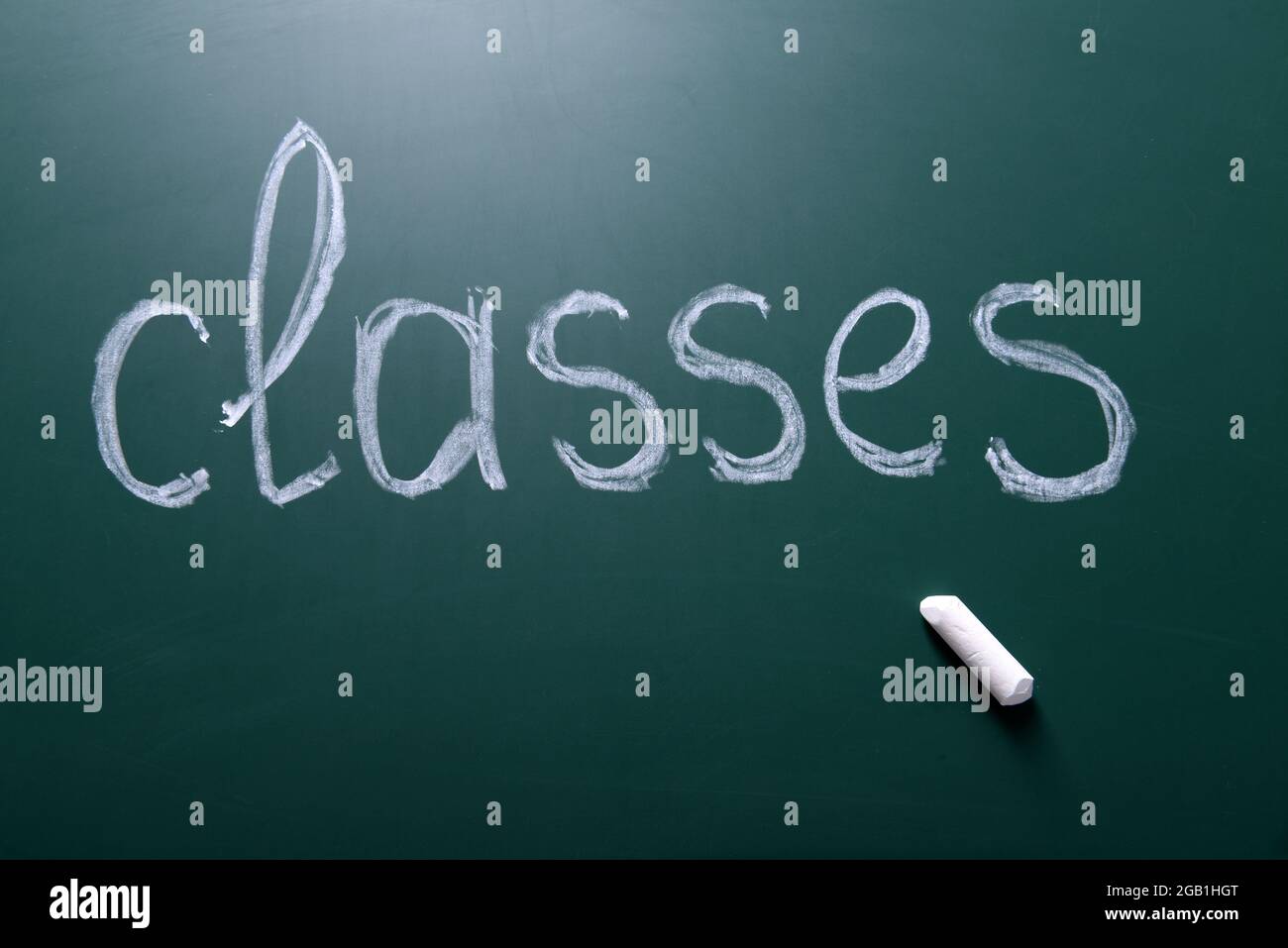 Classes inscription written with white chalk on blackboard Stock Photo ...