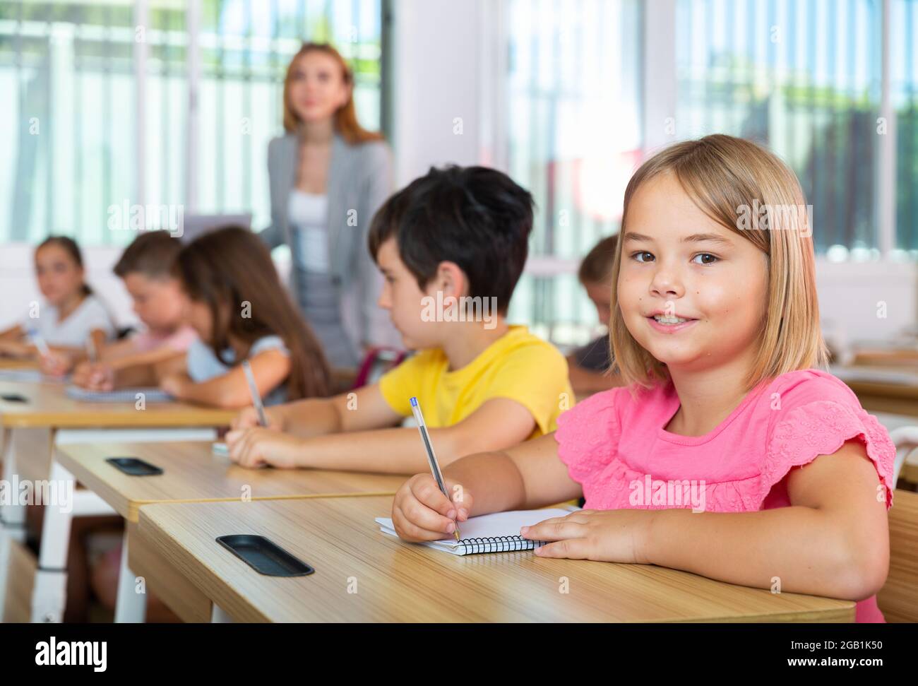 Kids studying in classroom Stock Photo - Alamy