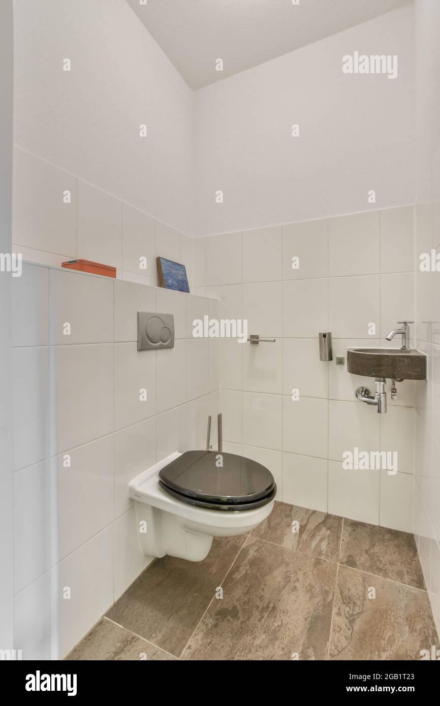 Interior of small clean washroom in miniature style Stock Photo - Alamy