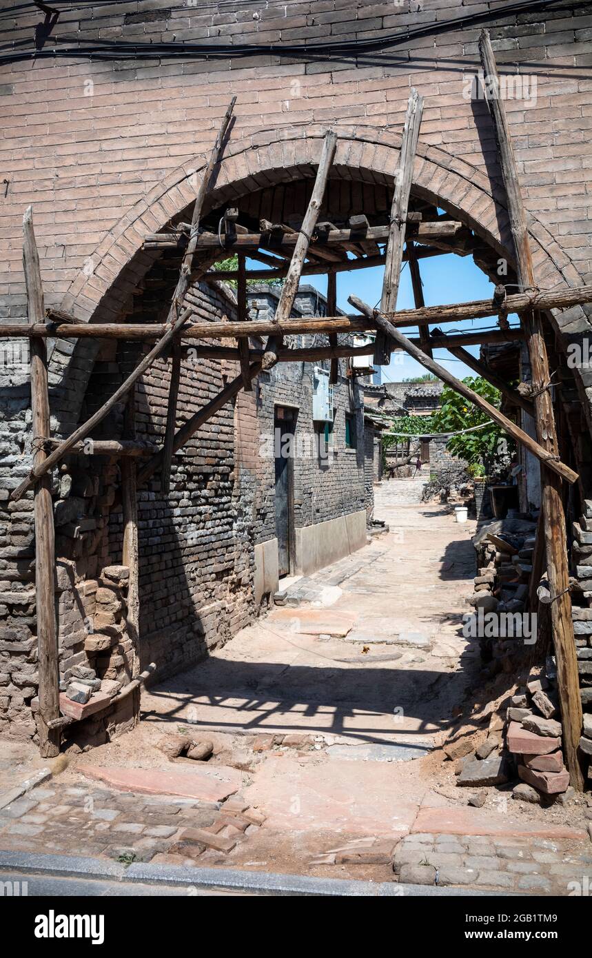 Pingyao, China. 31st July, 2021. Gate secured with wooden supports at ...