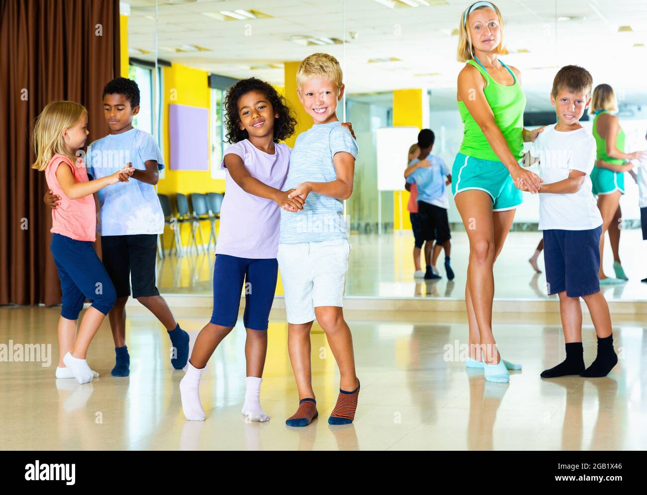 Children dancing together slow ballroom dances in pairs in chore Stock ...