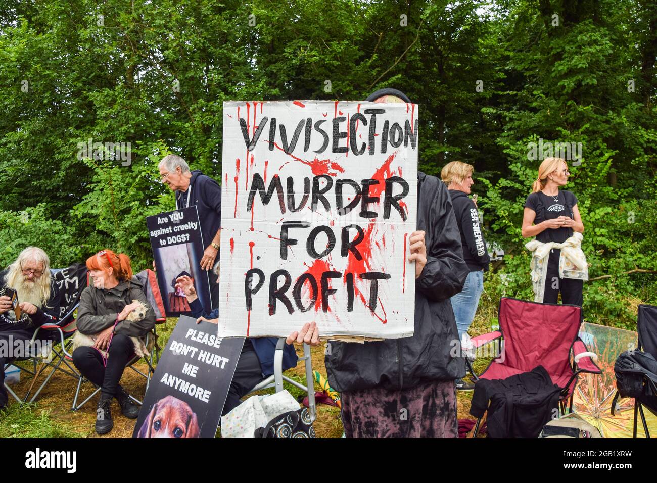 A demonstrator holds an anti-vivisection placard during the MBR Acres ...