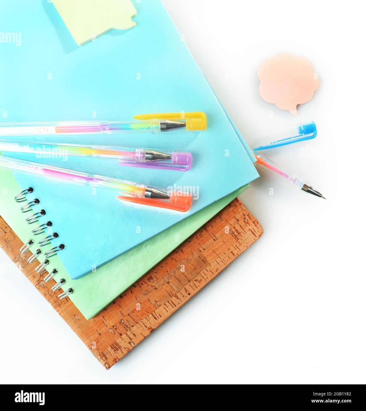 A pile of notebooks and stationary, isolated on white background Stock ...