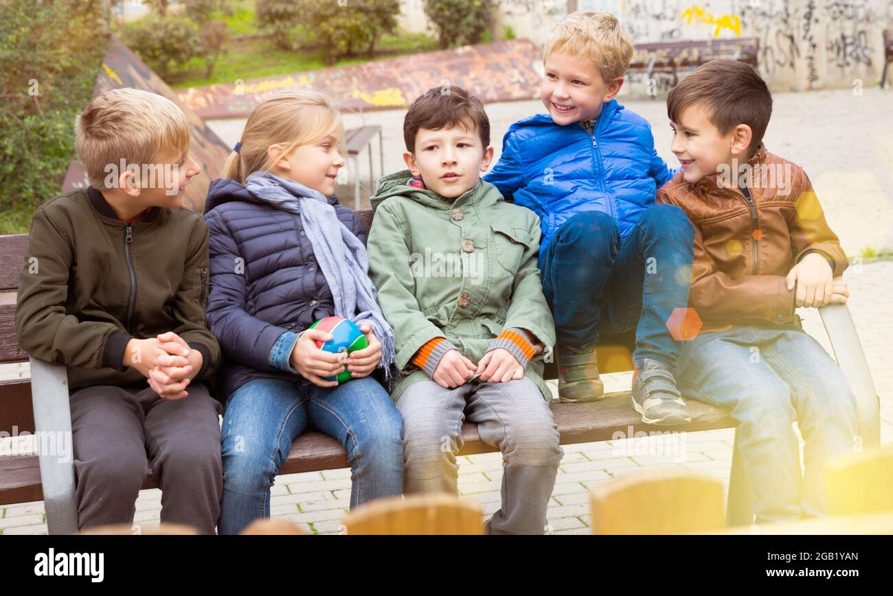 Children throwing ball together hi-res stock photography and images - Alamy