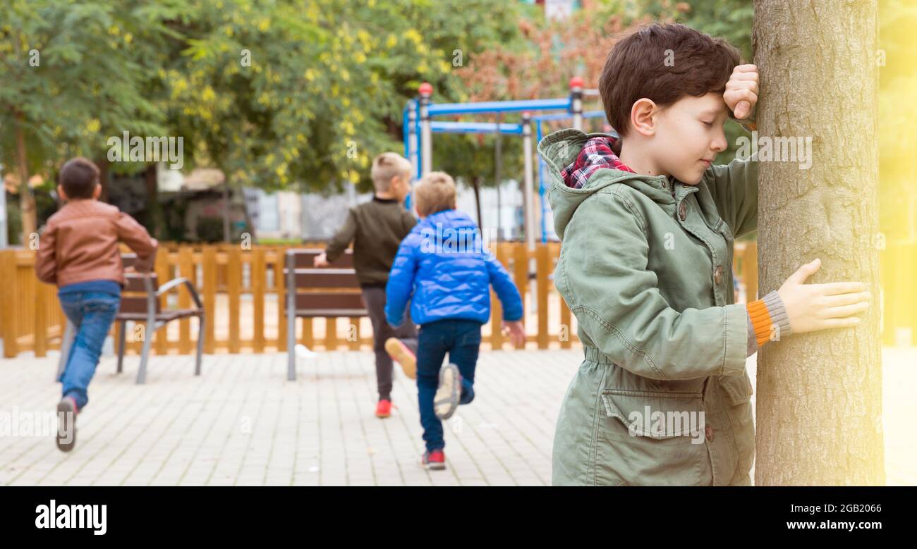 Kids playing hide and seek on the street Stock Photo - Alamy