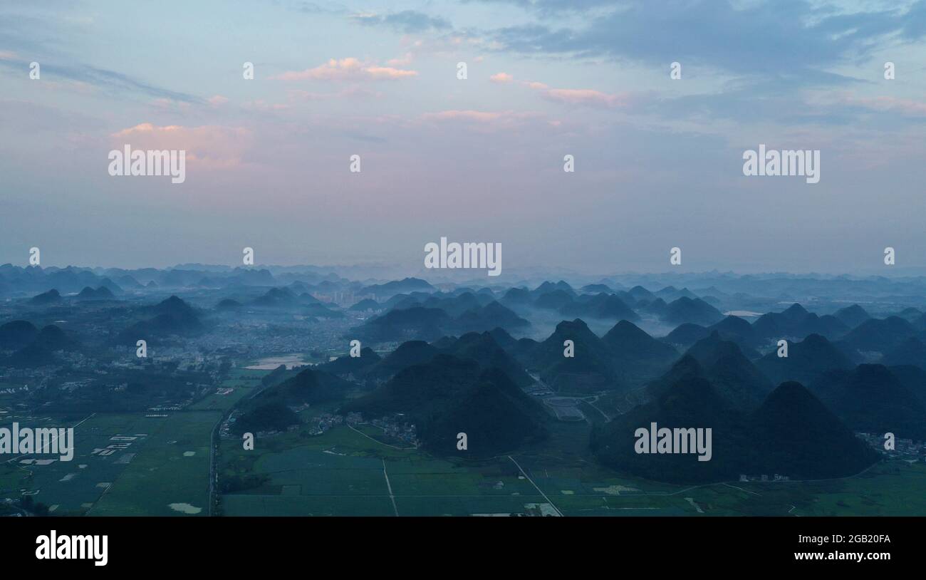ANLONG, CHINA - AUGUST 2, 2021 - Aerial photo shows multiple peaks in ...
