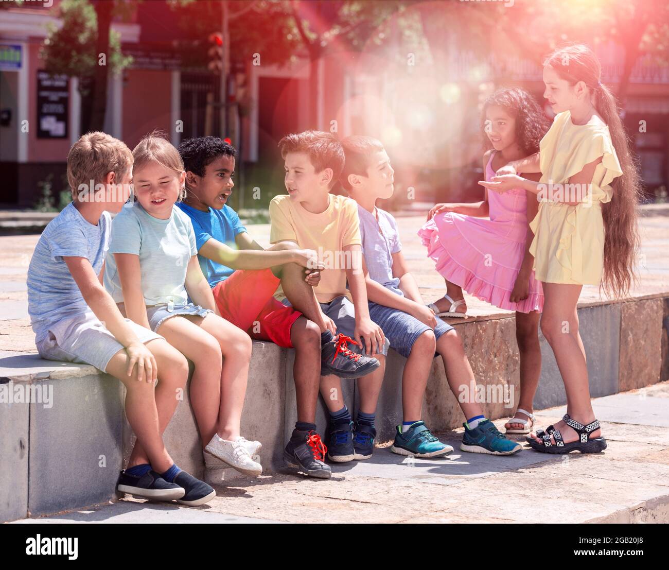 Portrait of children during conversation outdoors Stock Photo - Alamy