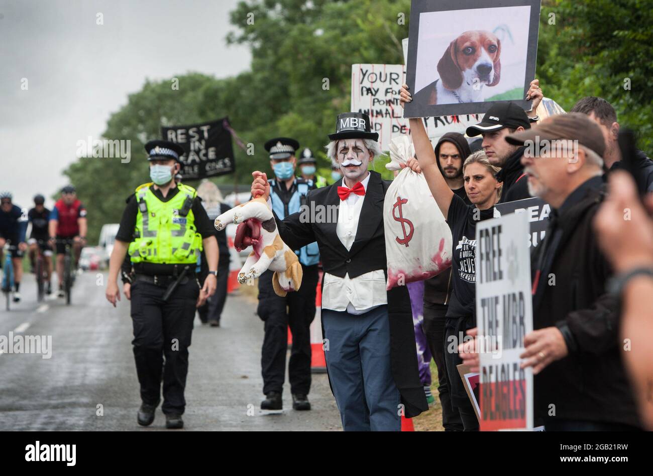 Protesters hold signs during the demonstration. Protesters from all ...