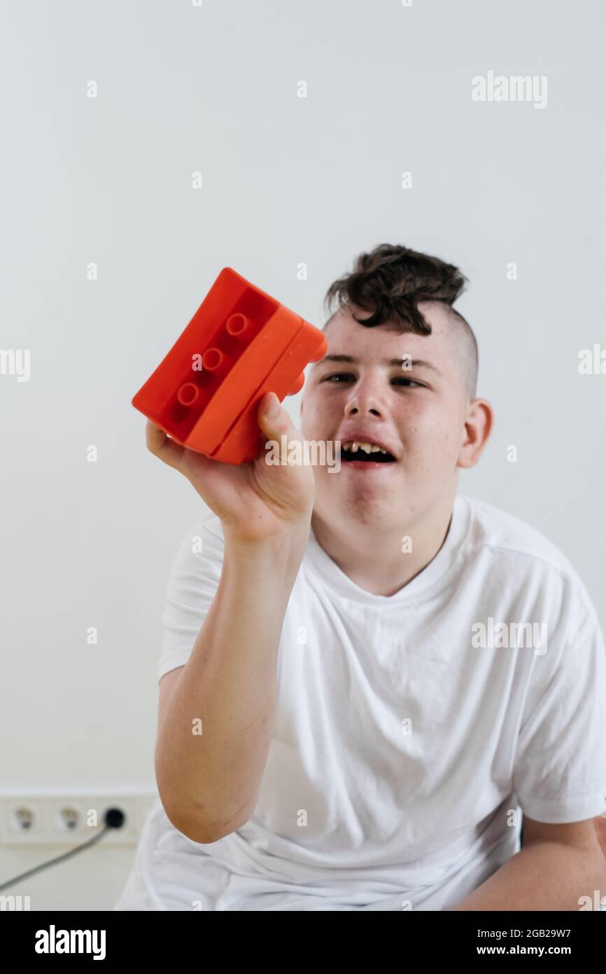 Disabled Teenage Child Build From Blocks Boy With Cerebral Palsy Doing disabled-teenage-child-build-from-blocks-boy-with-cerebral-palsy-doing
