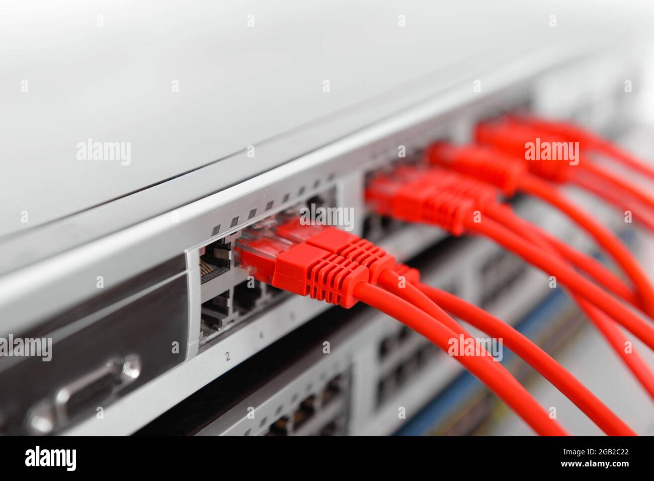 Red Ethernet cables connected to network switch, close up Stock Photo - Alamy
